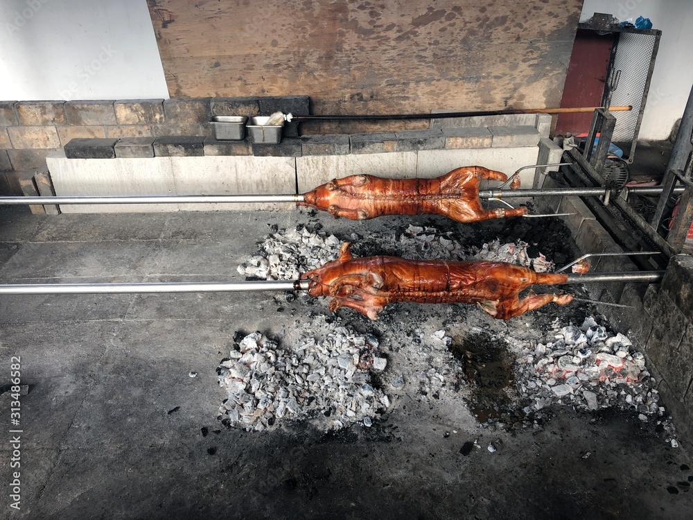 Full suckling pig roasted on the fire. Lechon Filipino BBQ Food Stock ...