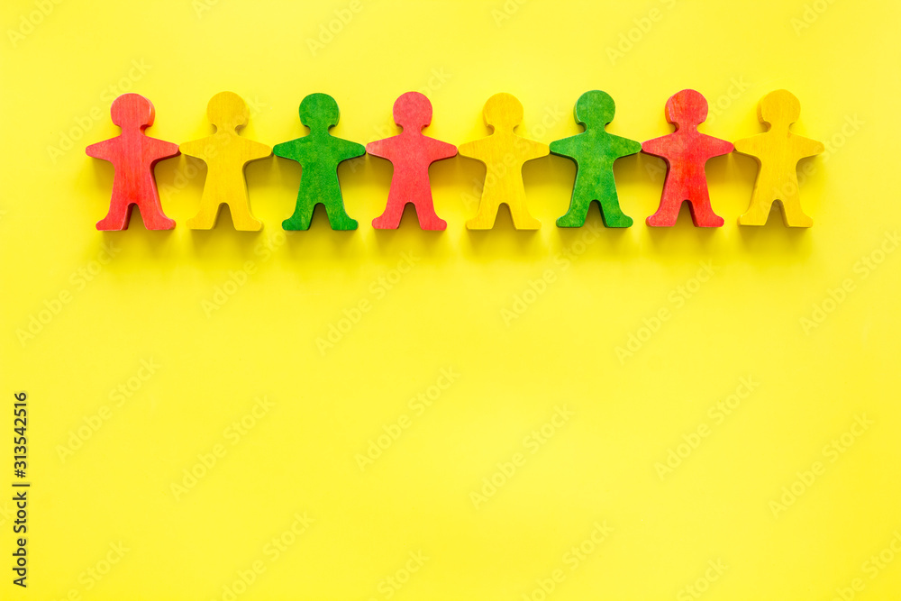 Team work, teambuilding concept. People cutouts on yellow background ...