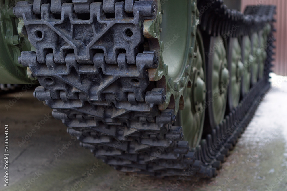 tracks of a tank fighting vehicle or an armored personnel carrier. The ...