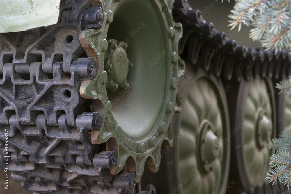 tracks of a tank fighting vehicle or an armored personnel carrier. The ...