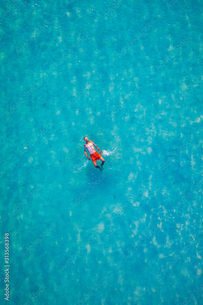 Person Floating On Water
