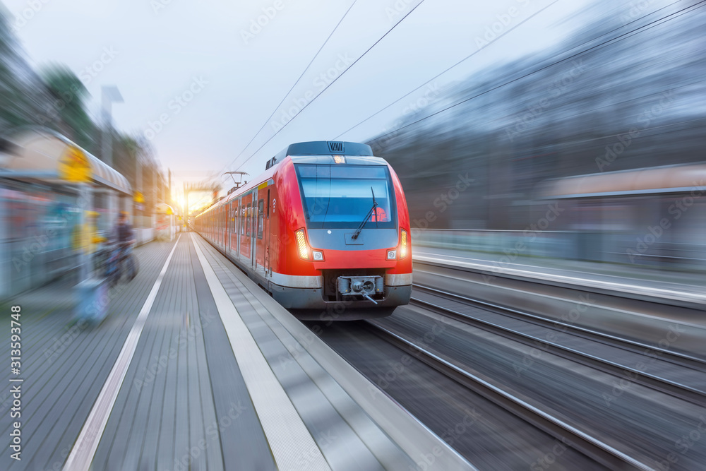 Passenger high speed red train with motion blur in station. Stock Photo ...