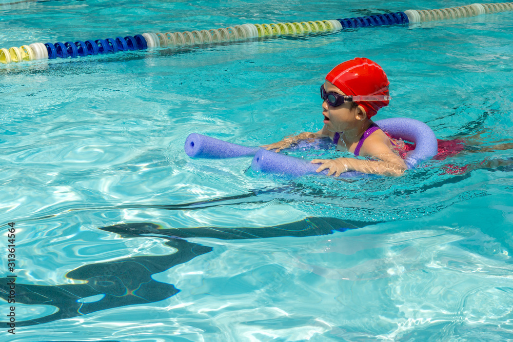 kid learn how to swim in swimming class Stock Photo | Adobe Stock