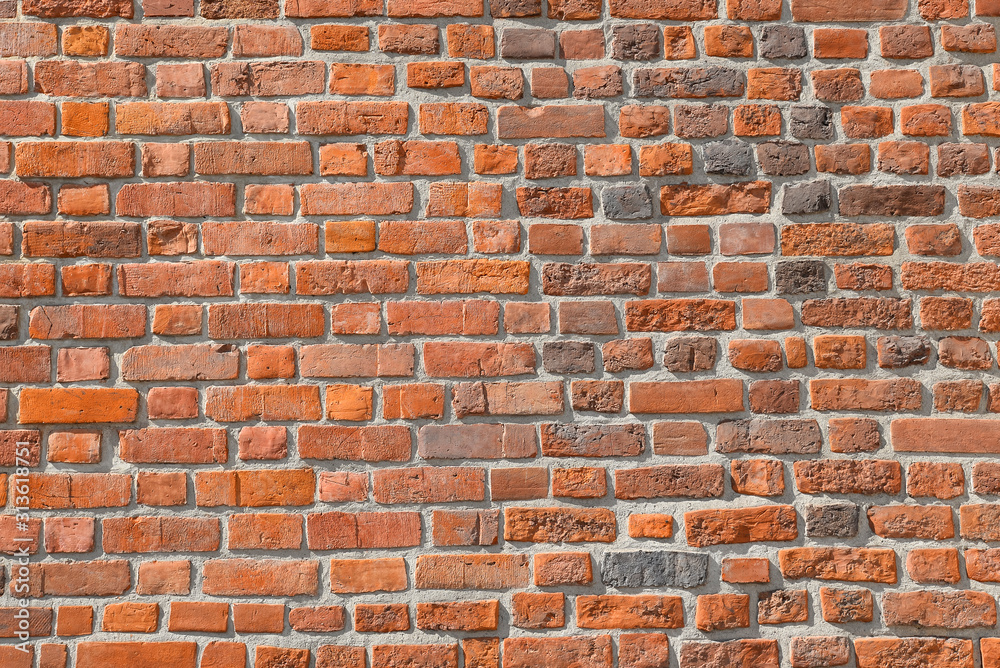 Brick wall background. Texture of a brick wall. Modern wallpaper design for web or graphic art projects. Stock Adobe Stock
