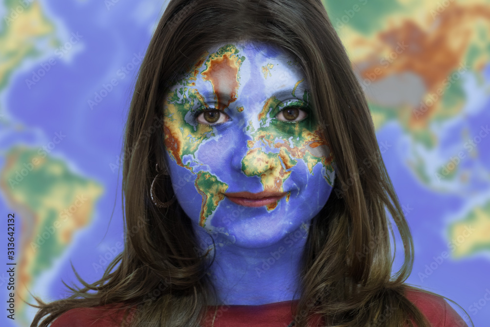 Girl with world map on her face. Stock Photo | Adobe Stock