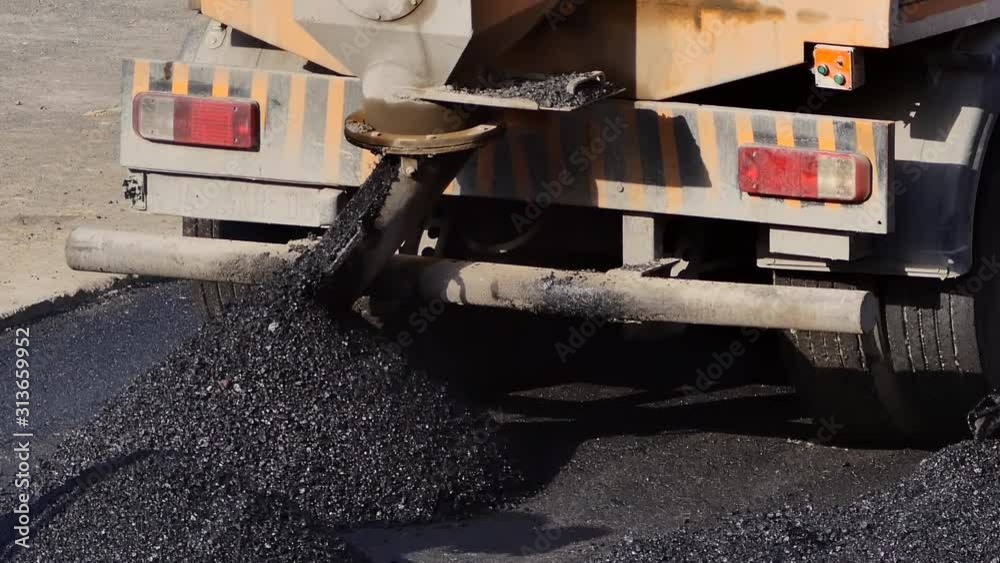 Hot mix asphalt. Crushed stone and a few grains of sand in the mix ...