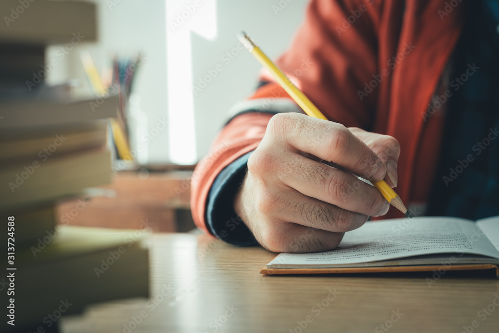 high school,university student study.hands holding pencil writing paper ...