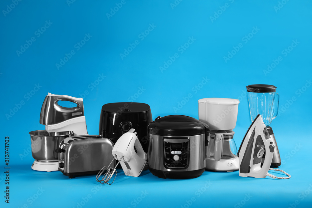 Set of different household appliances on light blue background Stock ...