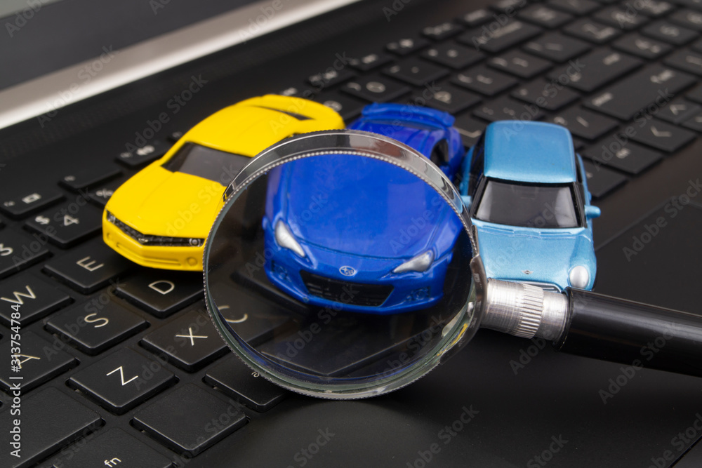 HO CHI MINH CITY, VIETNAM - JANUARY 05, 2020: Toy cars on laptop ...