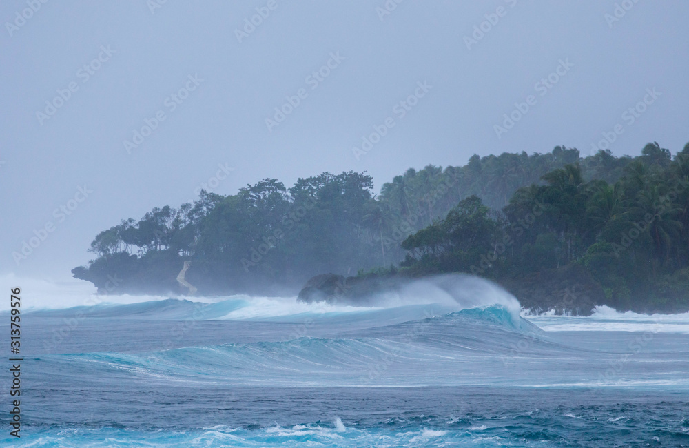Wind whipped spray off wave in stormy coastal conditions Stock Photo ...