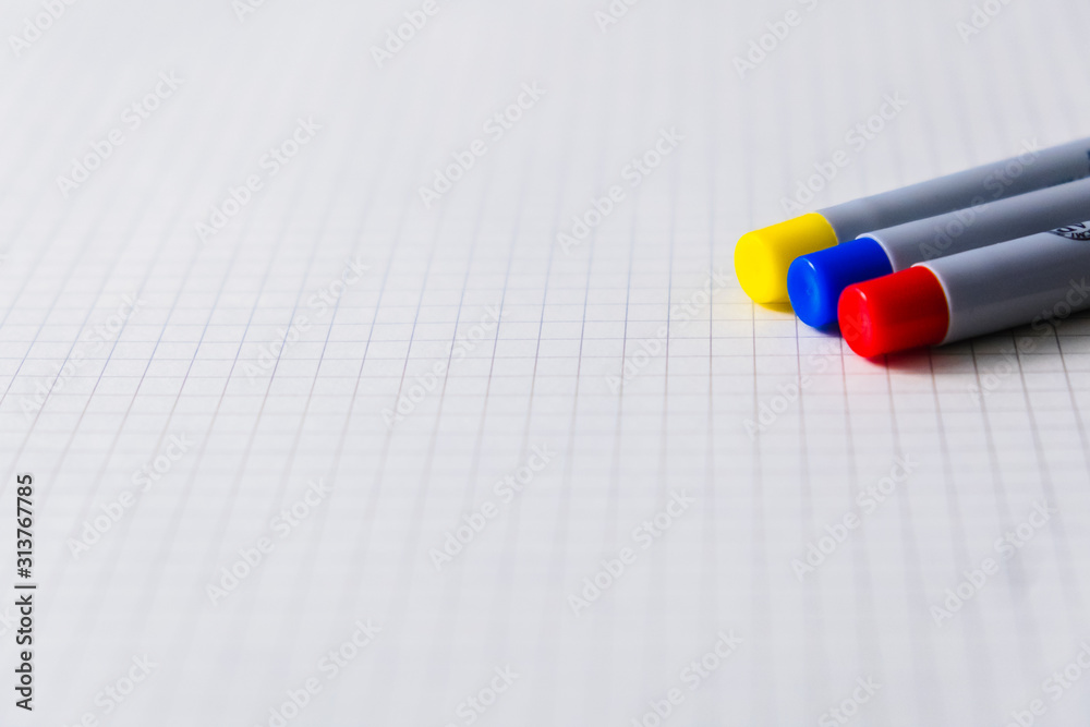 Three Primary colours/colors markers on grid/ graph paper for artists ...