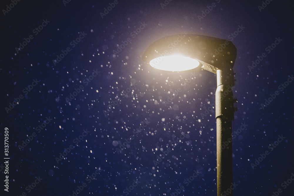 A modern looking street lamp post with rich blue background and white ...