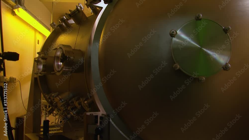 hands open a cyclotron particle accelerator. technology for atoms ...