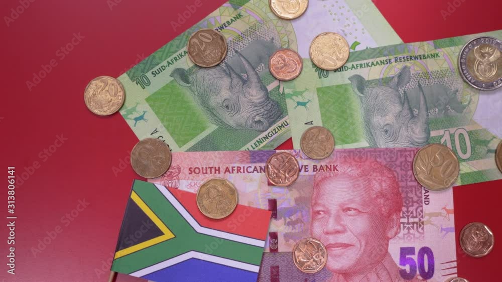 South African rand money banknotes and coins top view. ZAR official ...