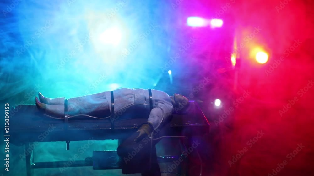 Lethal injection concept. Prisoner handcuffed to death by lethal ...