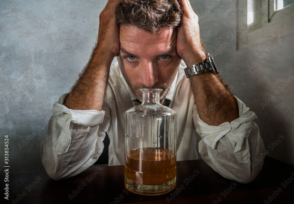 drunk man in lose necktie drinking alcohol desperate and wasted in ...
