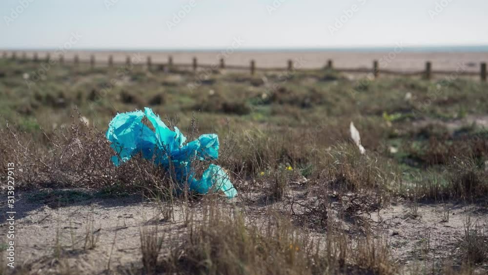 Environmental pollution. Sand beaches polluted with pieces of plastic ...