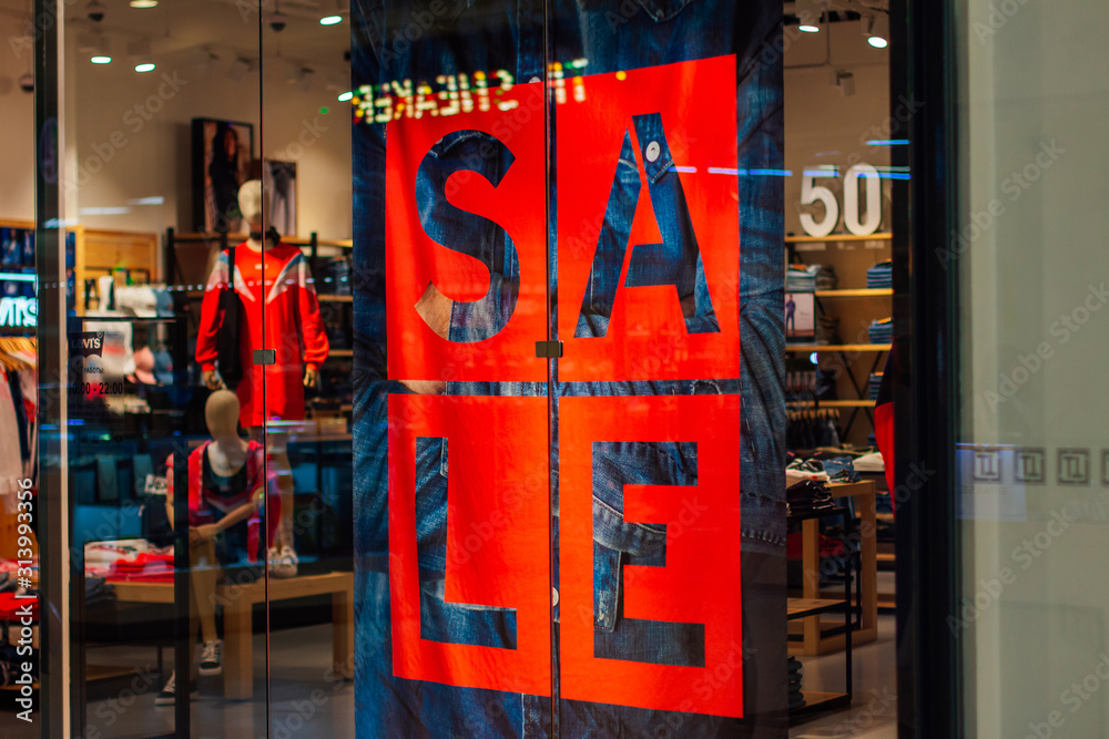 Storefronts with sale sign behind the glass window Stock Photo | Adobe ...
