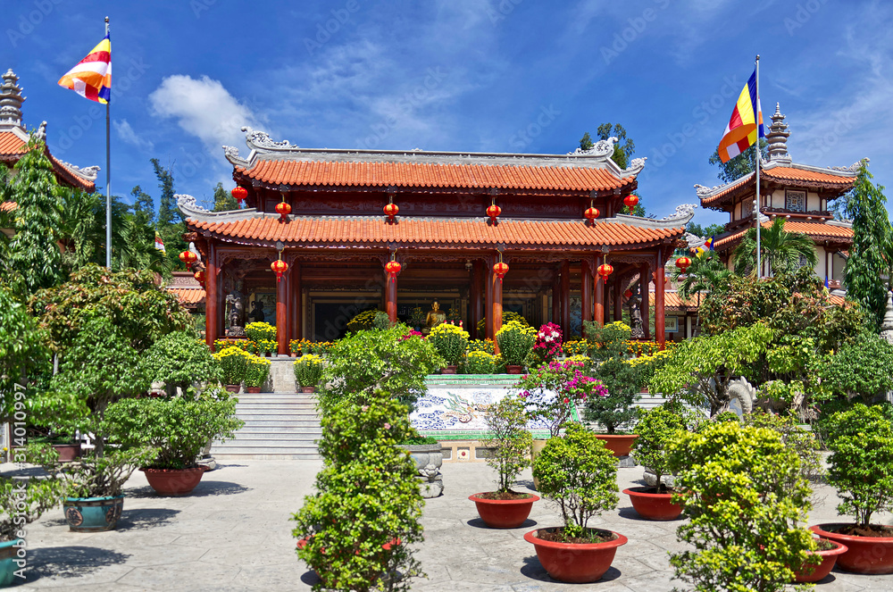 Buddhist temple in south Vietnam. Long Son Pagoda. Oriental garden with ...