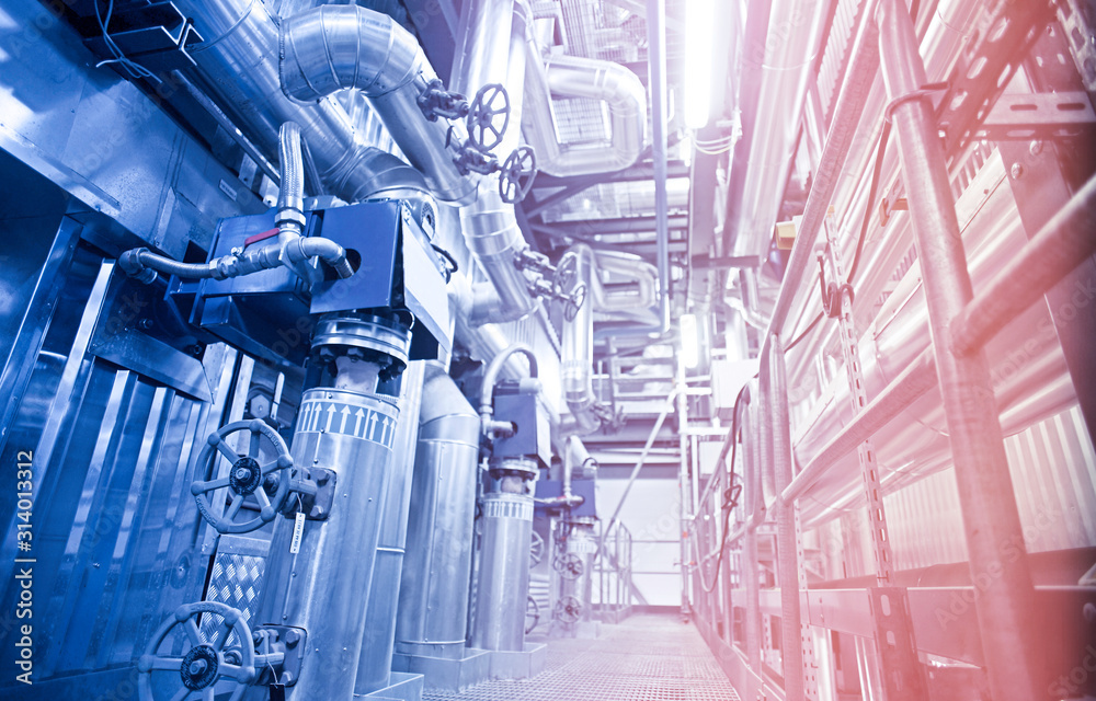 Equipment, cables and piping as found inside of a modern industrial ...