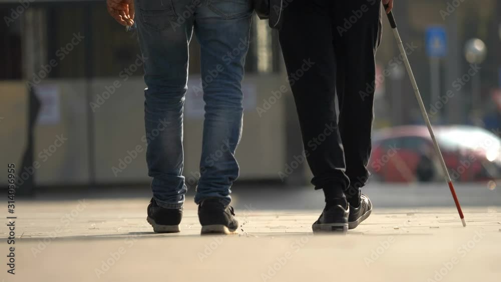 blind man walking on sidewalk in the city with his friend Stock Video ...