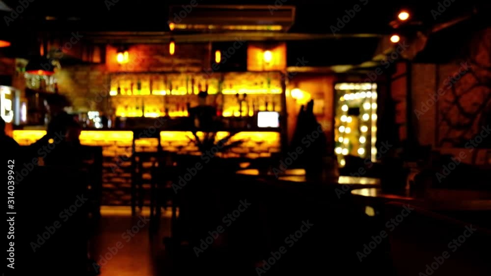 Blurred video of the interior of a large beautiful restaurant in low ...