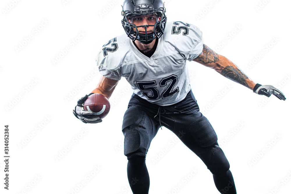 American football player. Sportsman with ball in helmet on stadium in ...