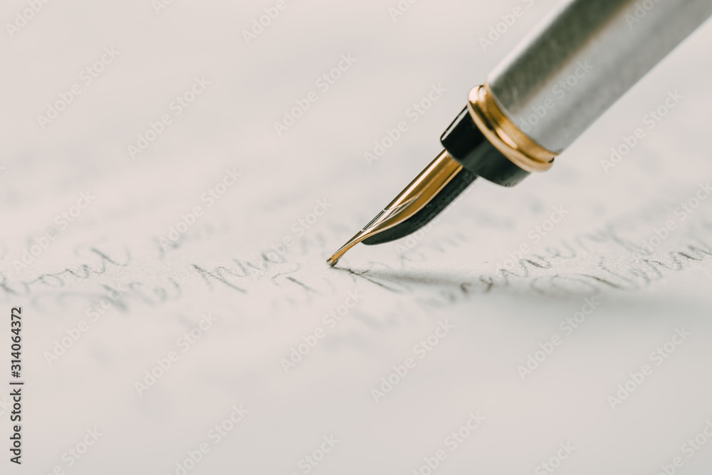 Fountain pen on an ancient handwritten letter. Old story. Retro style ...
