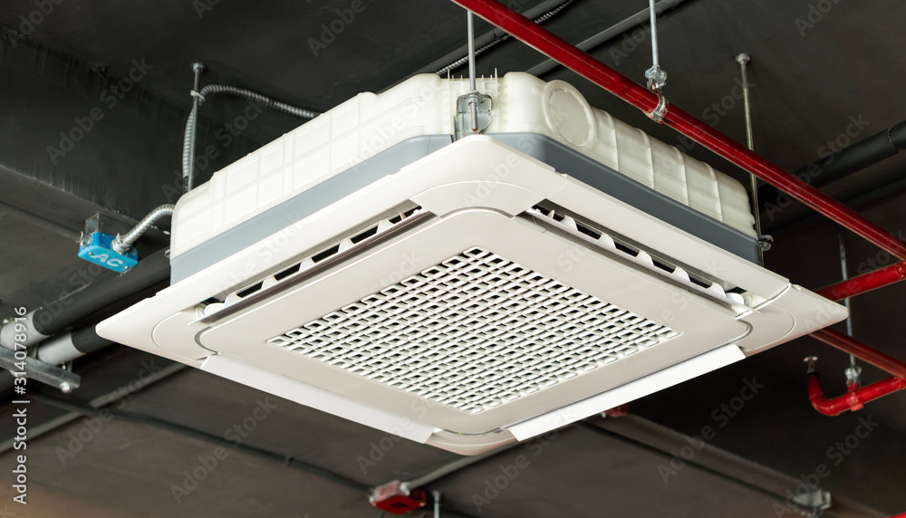 Ceiling mounted air conditioner installed in large office building ...