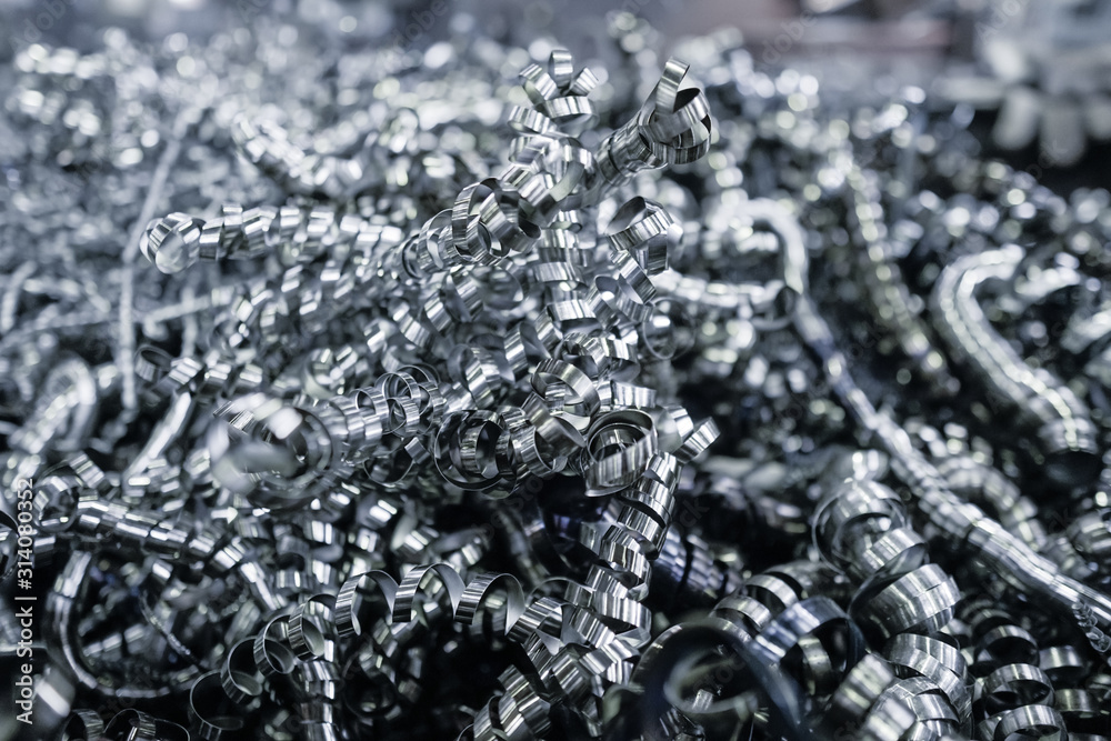 Twisted spiral steel from CNC lathe machine, close up scrap metal ...