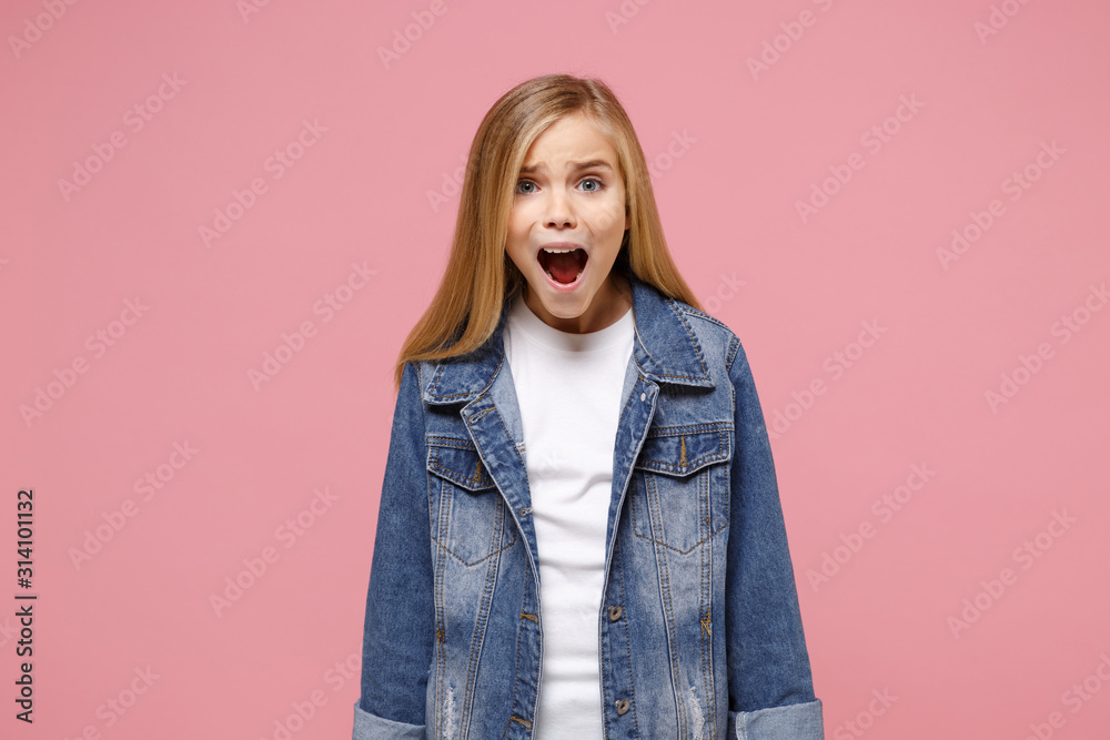 Shocked scared little blonde kid girl 12-13 years old in denim jacket ...