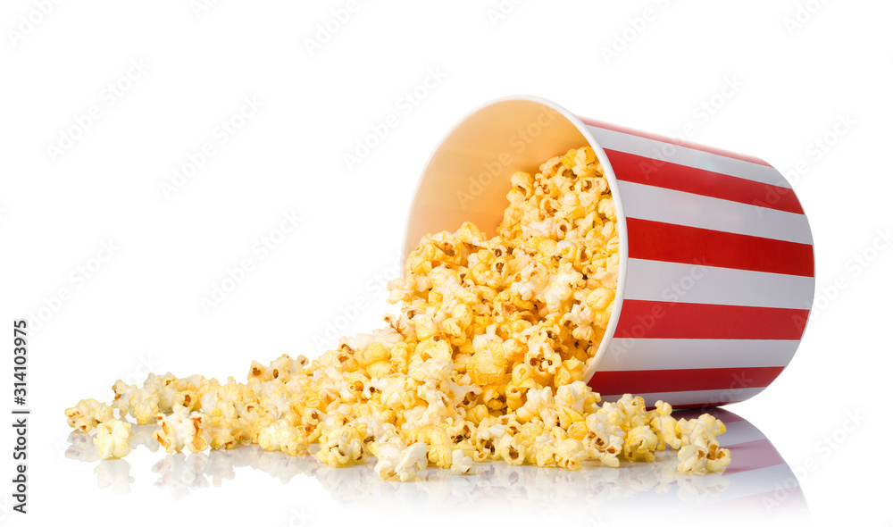 Scattered popcorn from paper striped bucket isolated on white ...
