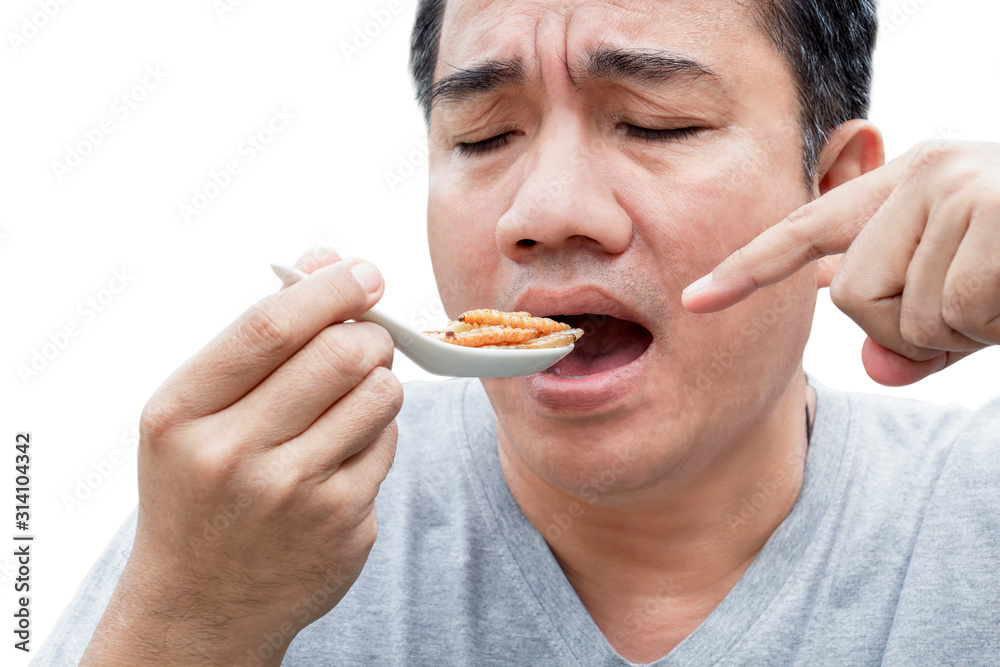 Food Insect: Man hand holding spoon eating Bamboo Worm insect or Bamboo ...