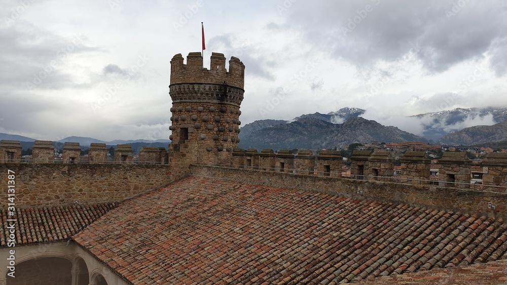 View of the light brown roof of a medieval Spanish castel on a ...
