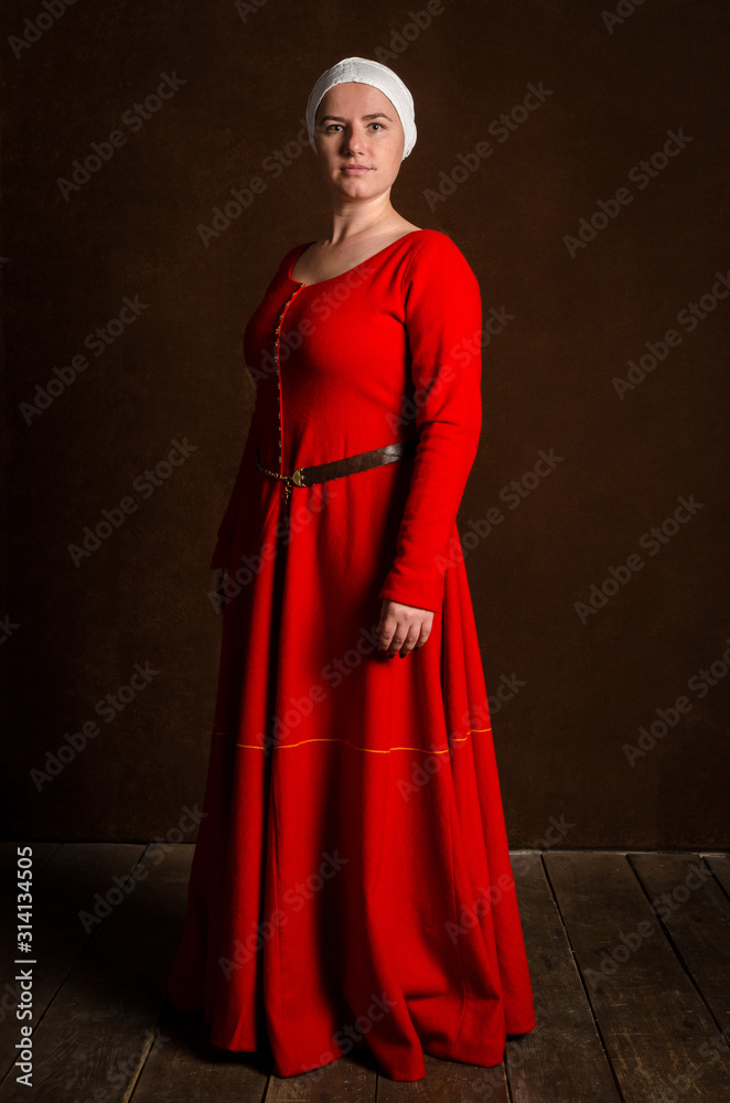 Beautiful sophisticated girl actress in a medieval costume of the 14th ...