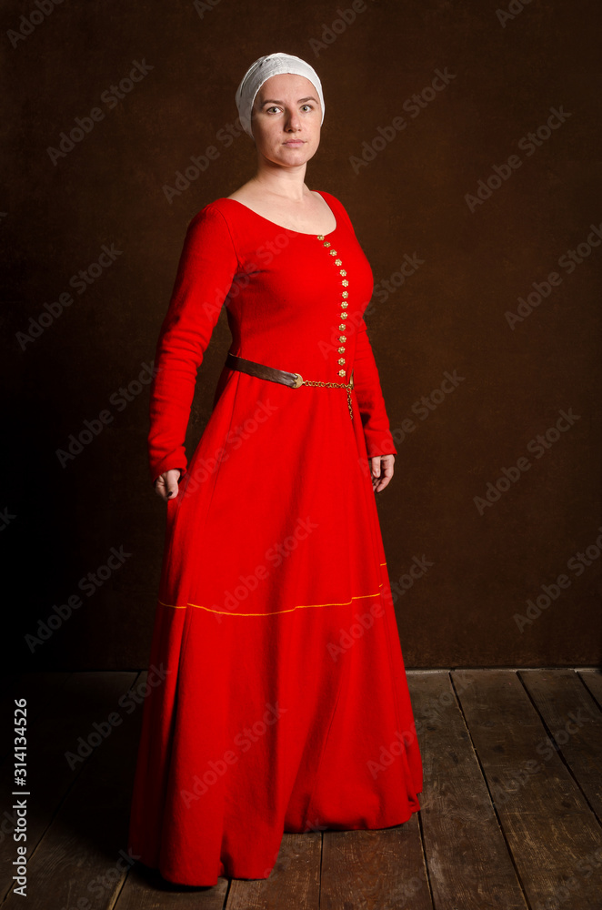 Beautiful sophisticated girl actress in a medieval costume of the 14th ...