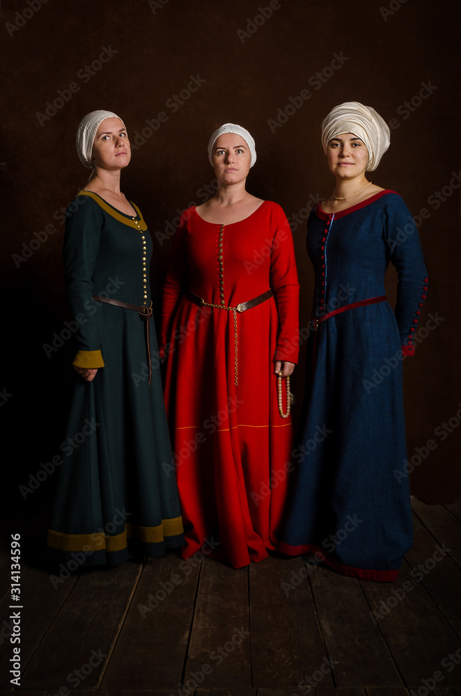 Three Beautiful Sophisticated Actress Girls In A Medieval Costume Of