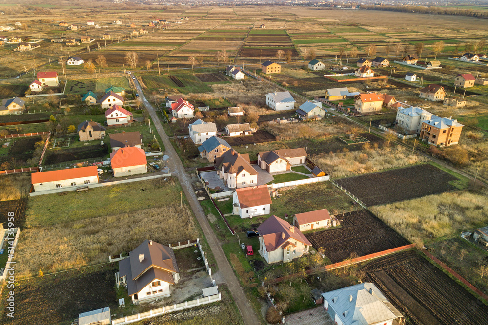 Aerial landscape of small town or village with rows of residential ...