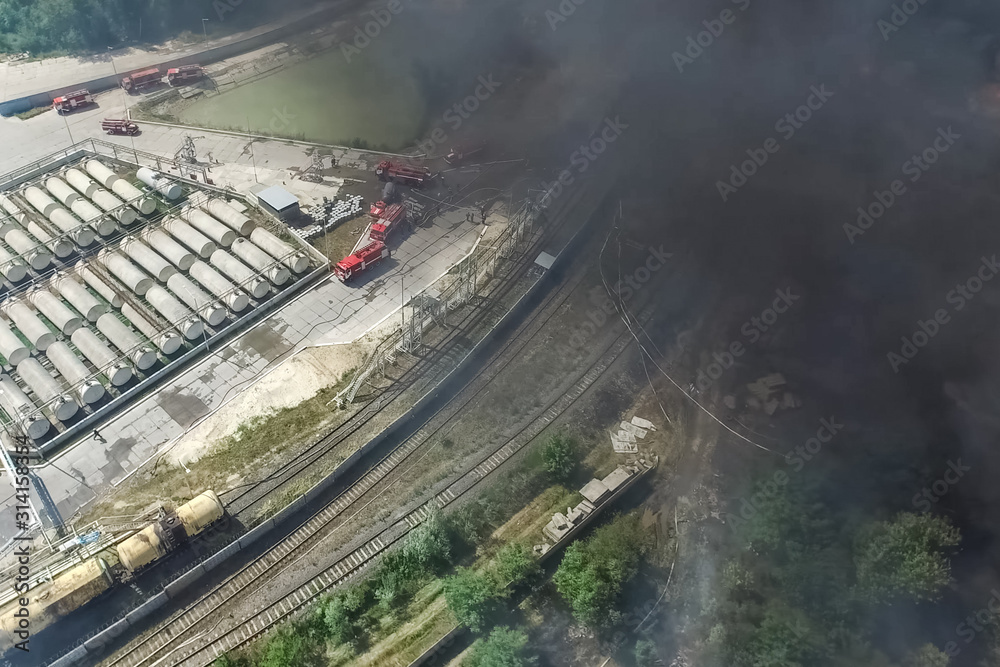 Oil storage fire. The tank farm is burning, black smoke is combu Stock ...