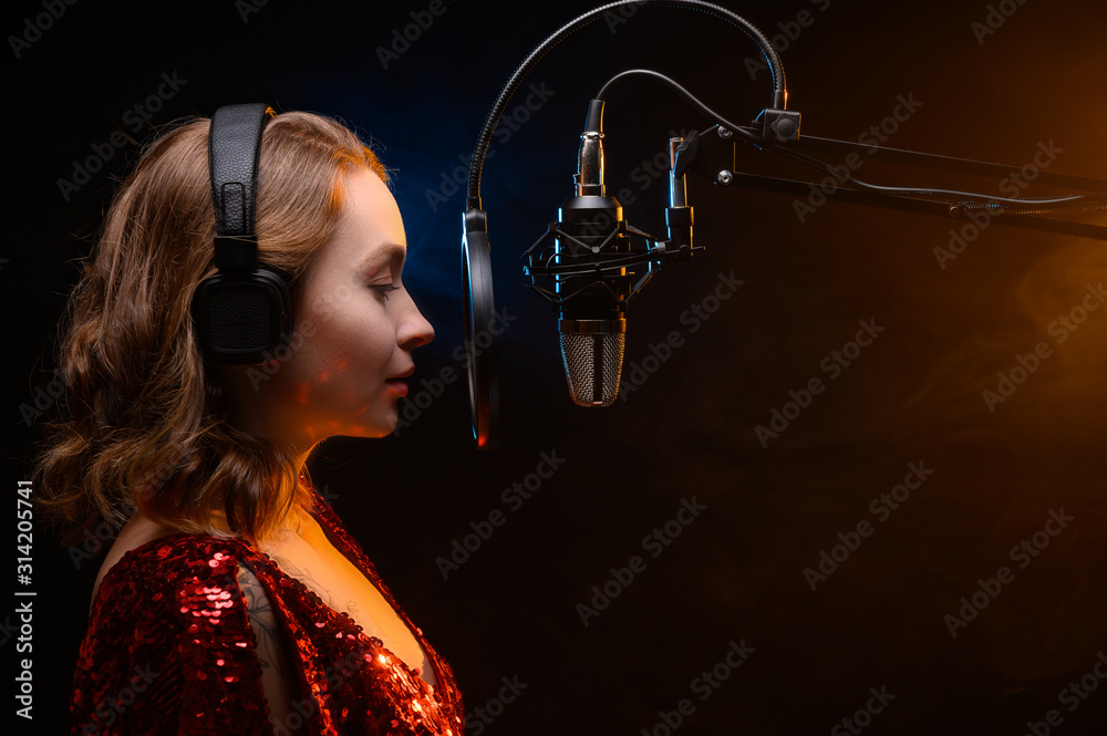 Girl singing into a microphone. Love for music. Screensaver for ...