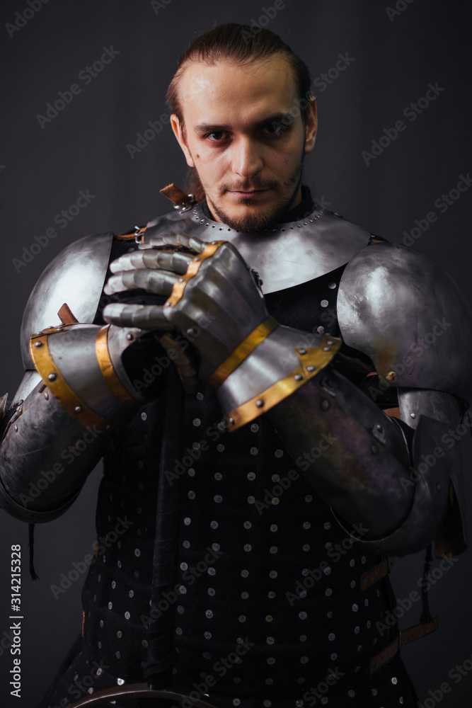 Portrait of a medieval knight with a two-handed sword. Warrior in the ...