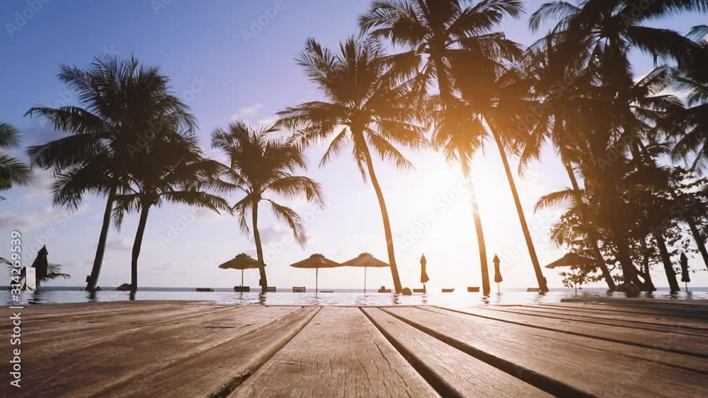 Empty wooden table top with tropical beach resort landscape in ...