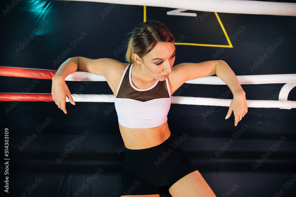 girl in a boxing ring,Young sports girls and boy are engaged in fitness ...