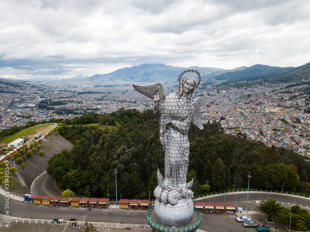 Beautiful view of Virgen del Panecillo statue on top of a hill in the ...