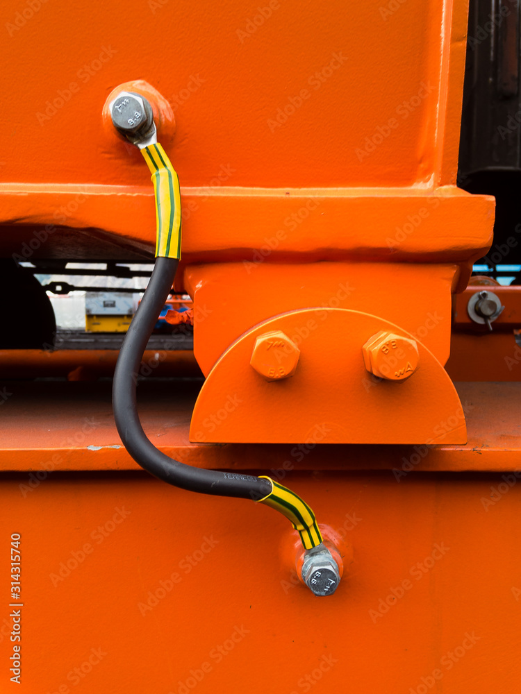 Bolt fastening of the grounding cord to the metal part of the mechanism ...