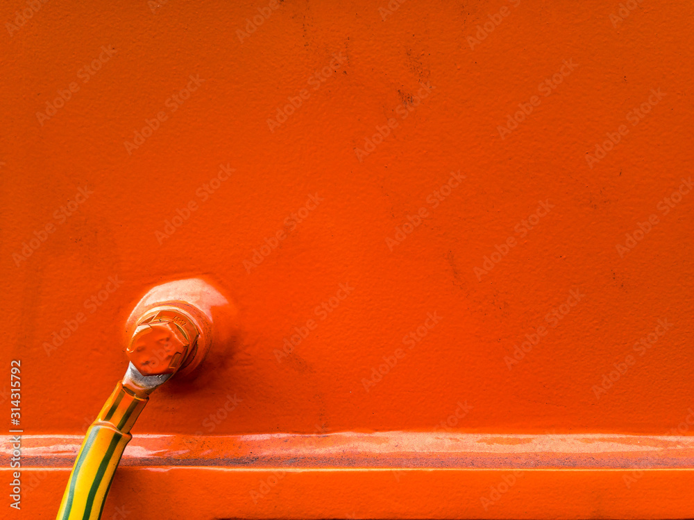 Attaching the ground cord to the metal part of the gantry crane ...