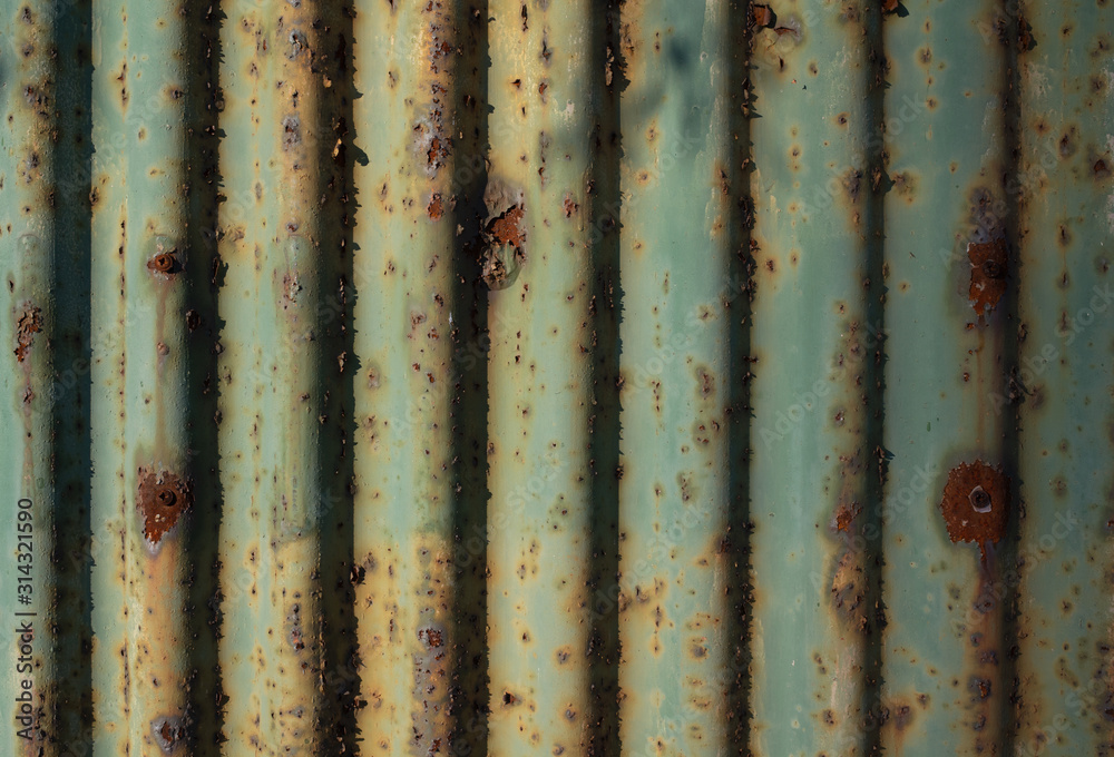 Fence and wall made of currugated iron - structure and surface of ...