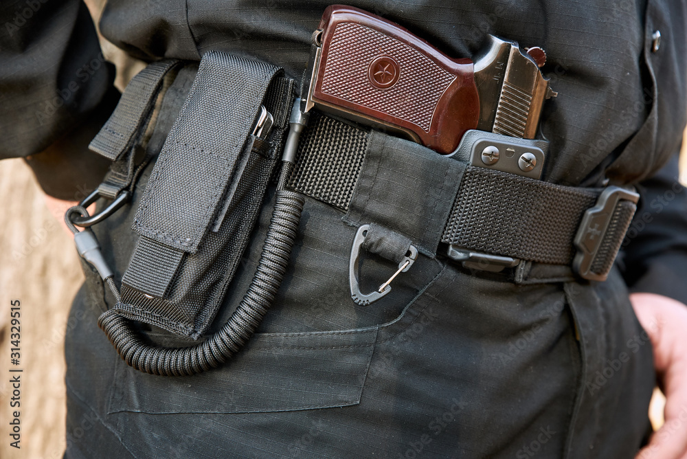 Army set on a man?s belt: carbine, pistol, lasso. Stock Photo | Adobe Stock