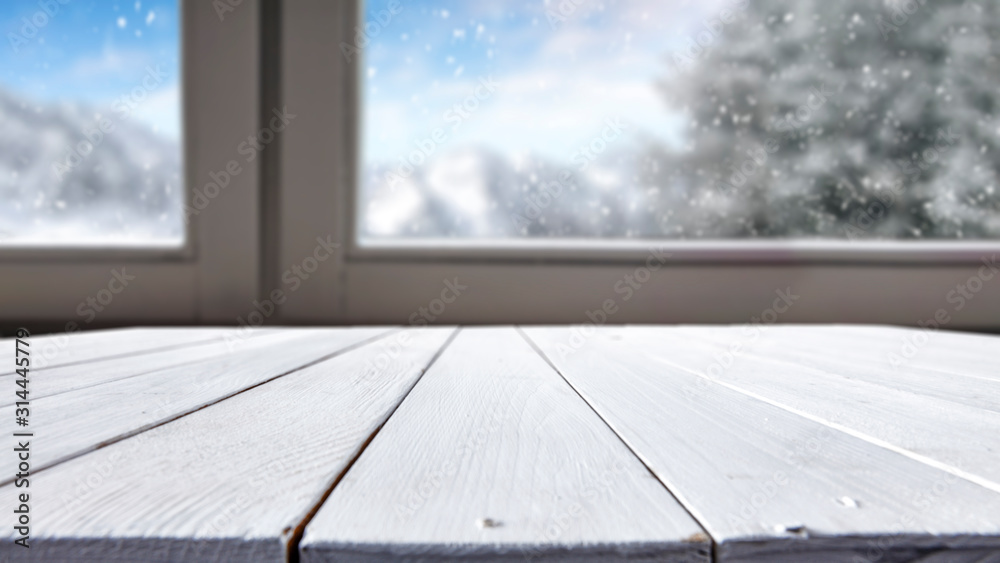 Desk of free space and winter window background Stock Photo | Adobe Stock
