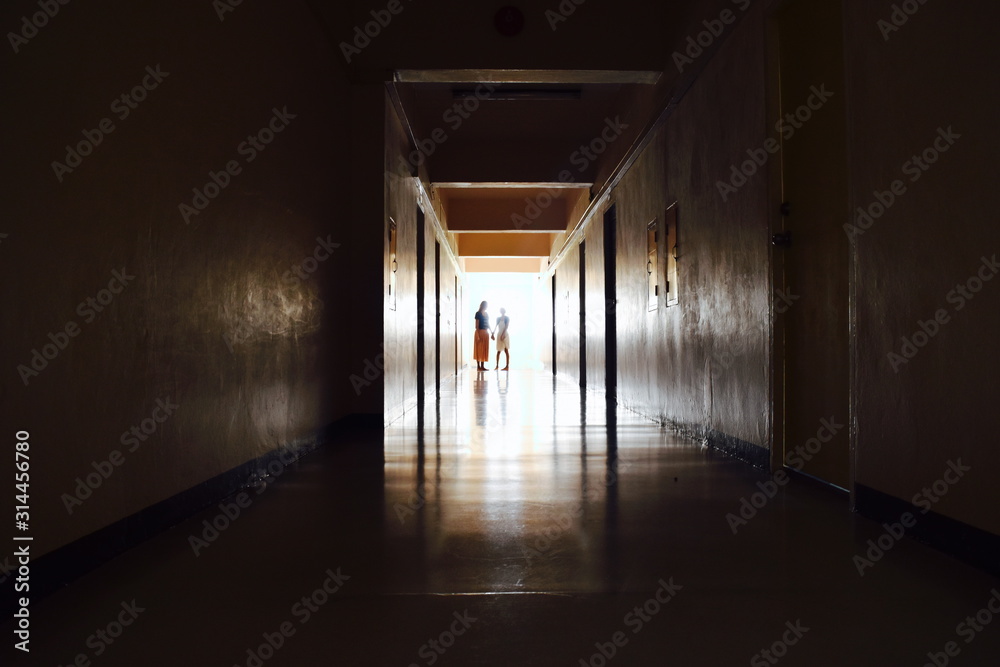 Creepy hallway with light. Gloomy tunnel. The Ghost of a little girl in ...
